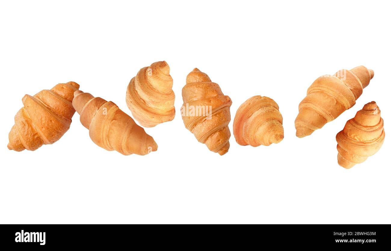 Flying croissants on white background Stock Photo - Alamy