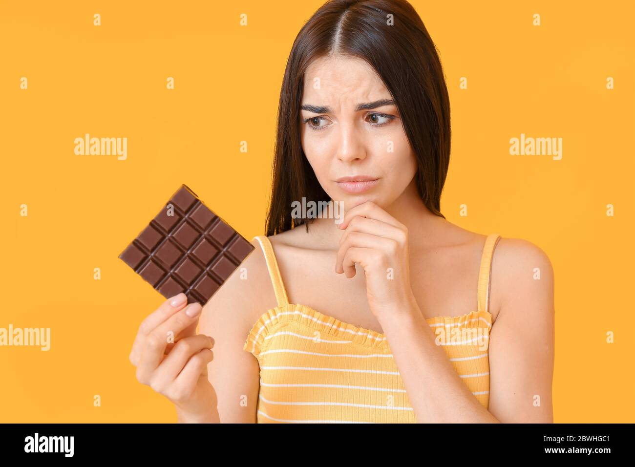 Sad girl with chocolate hi-res stock photography and images - Alamy