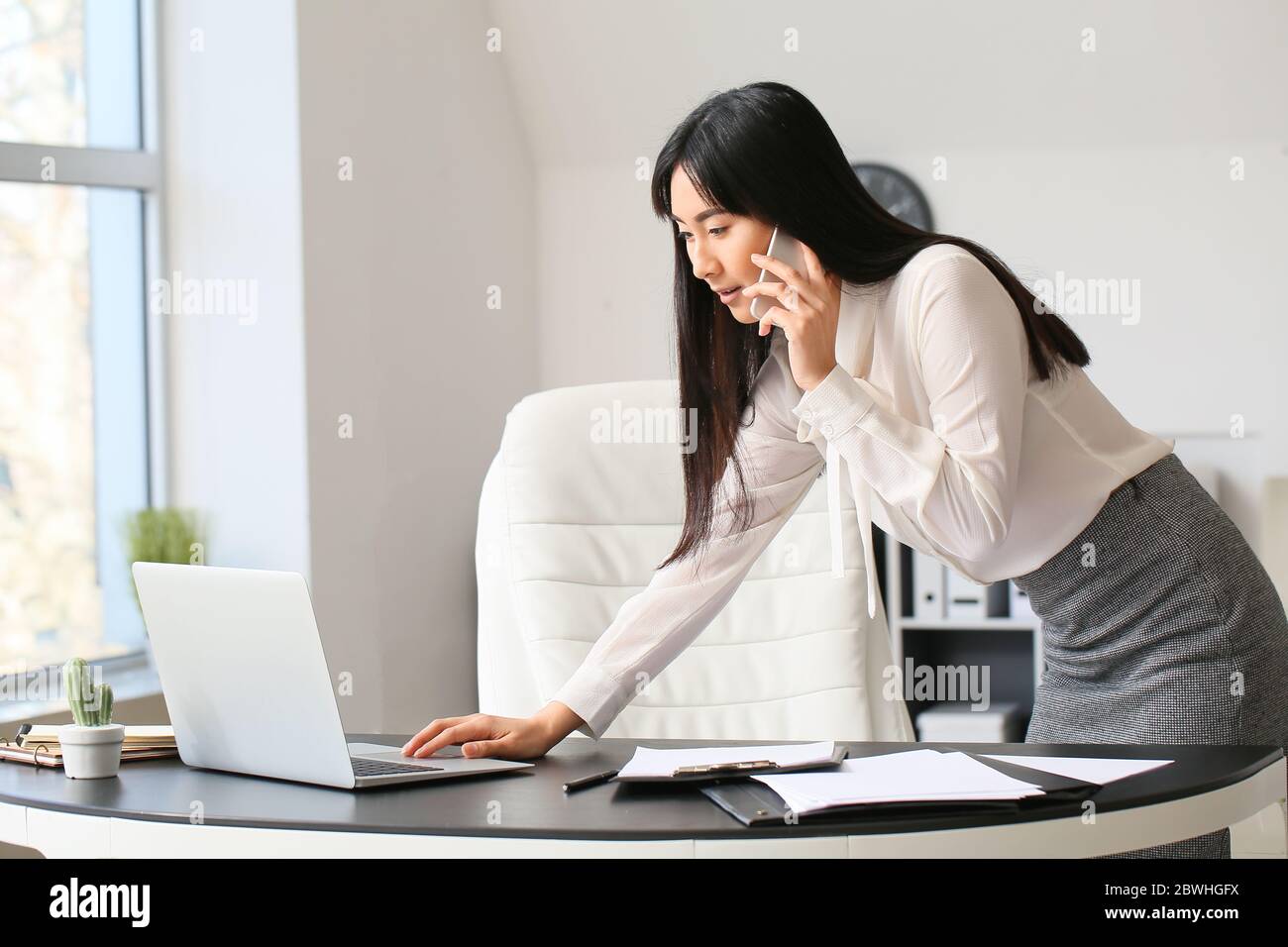 Beautiful Asian secretary working in office Stock Photo - Alamy