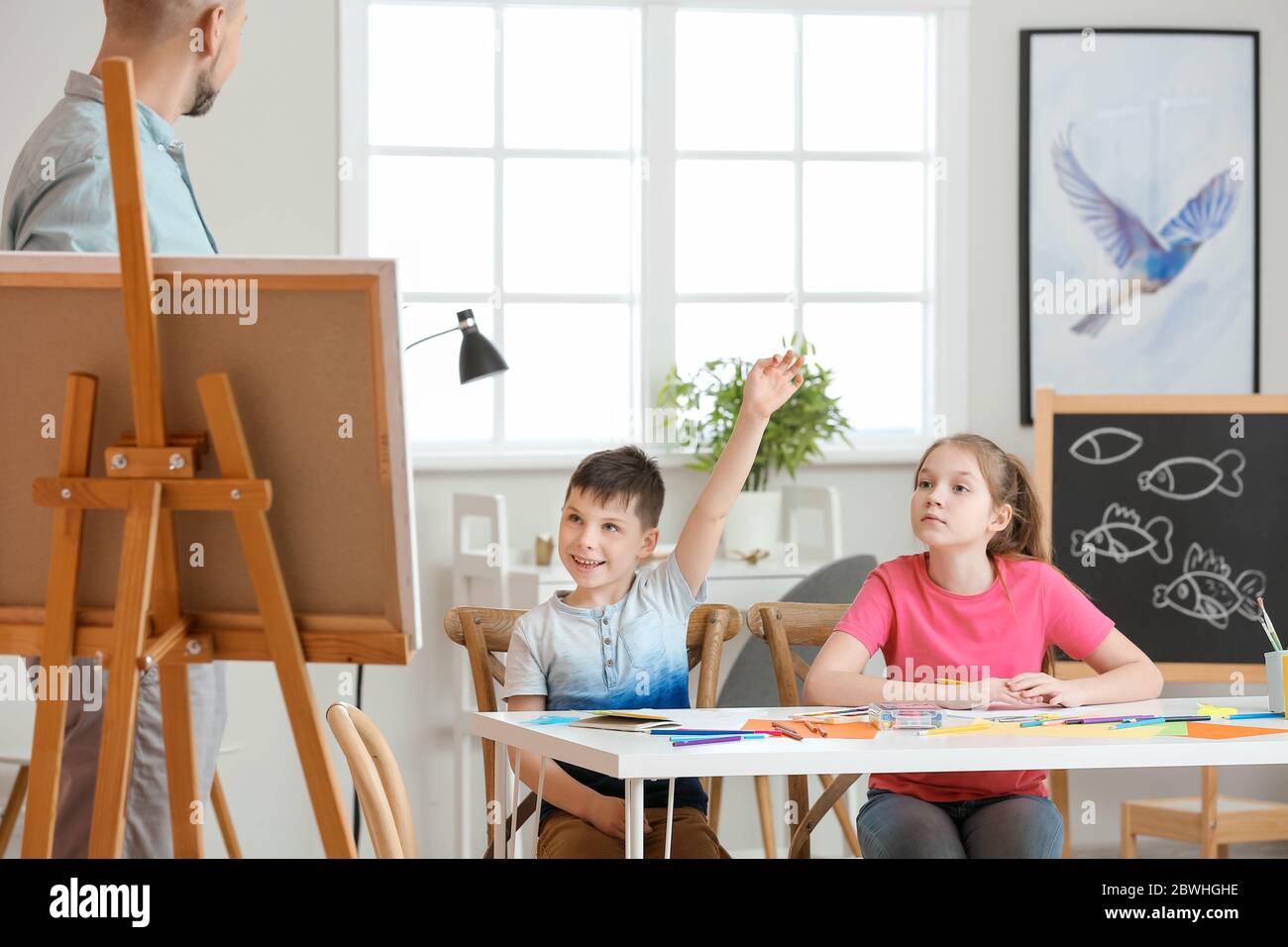 Drawing teacher giving private lessons at home Stock Photo - Alamy