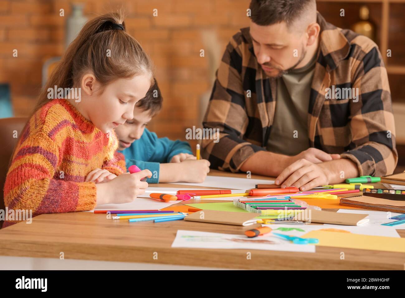 Drawing teacher giving optional classes at school Stock Photo - Alamy