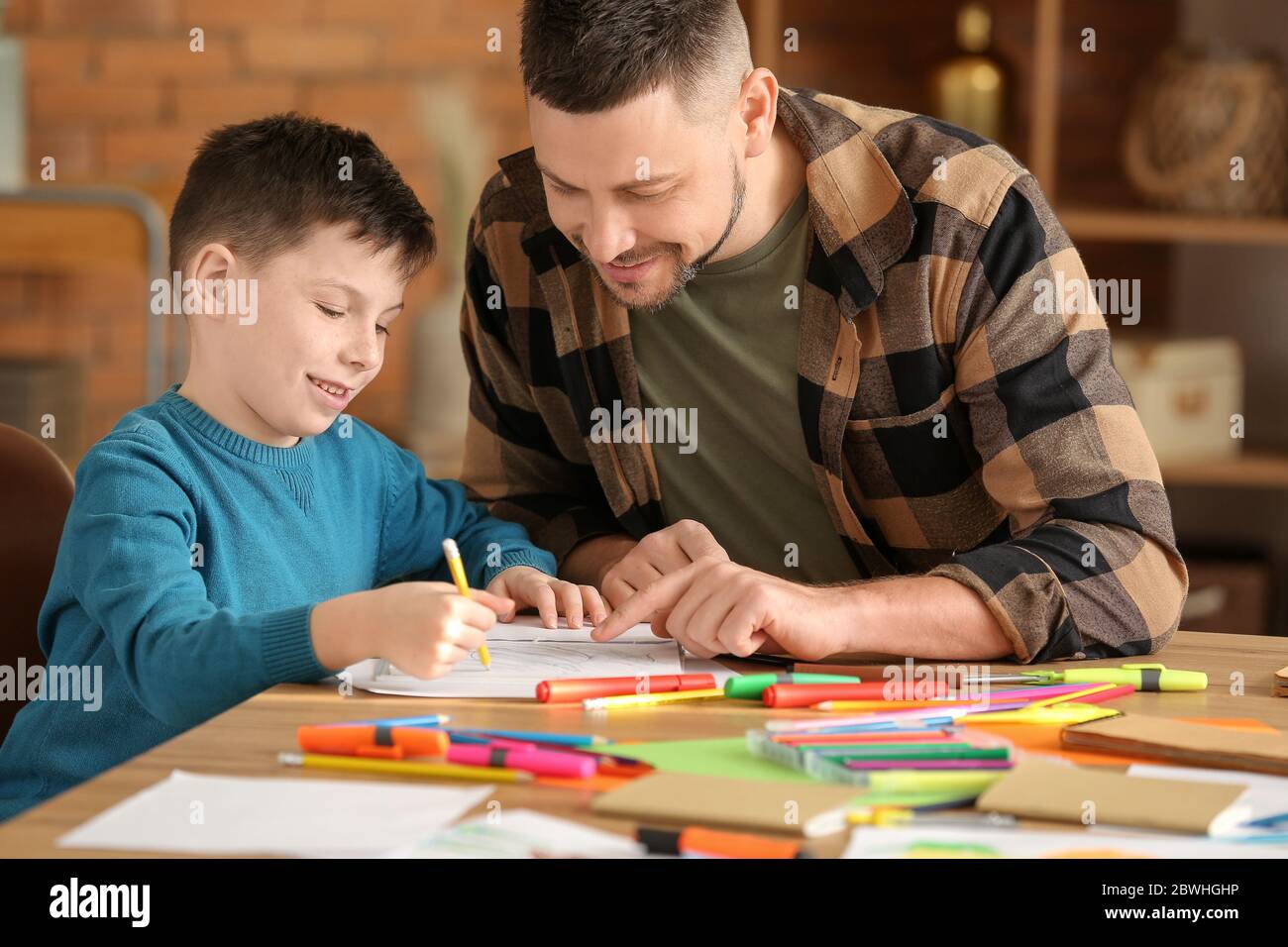 Drawing teacher giving optional classes at school Stock Photo - Alamy