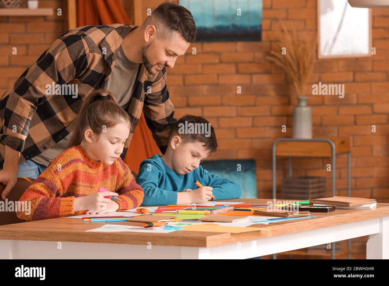 Drawing teacher giving optional classes at school Stock Photo - Alamy