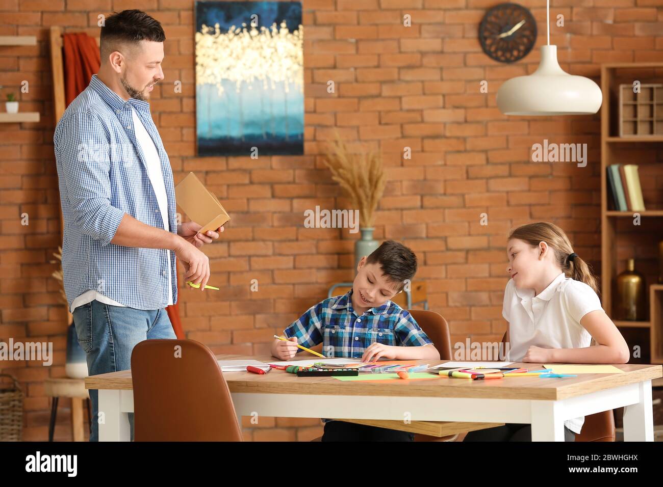 Drawing teacher giving optional classes at school Stock Photo - Alamy