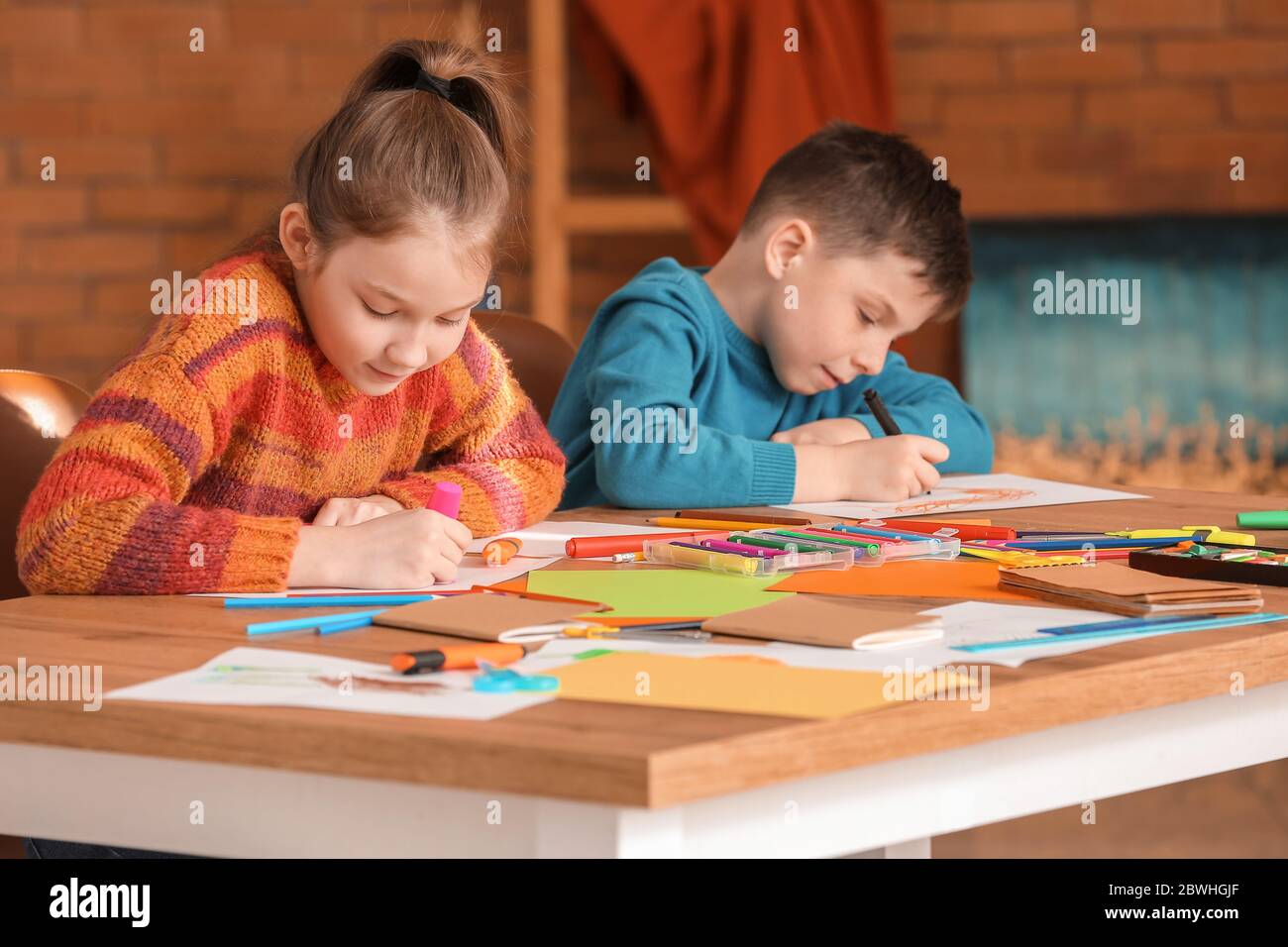 Cute children drawing at school Stock Photo - Alamy
