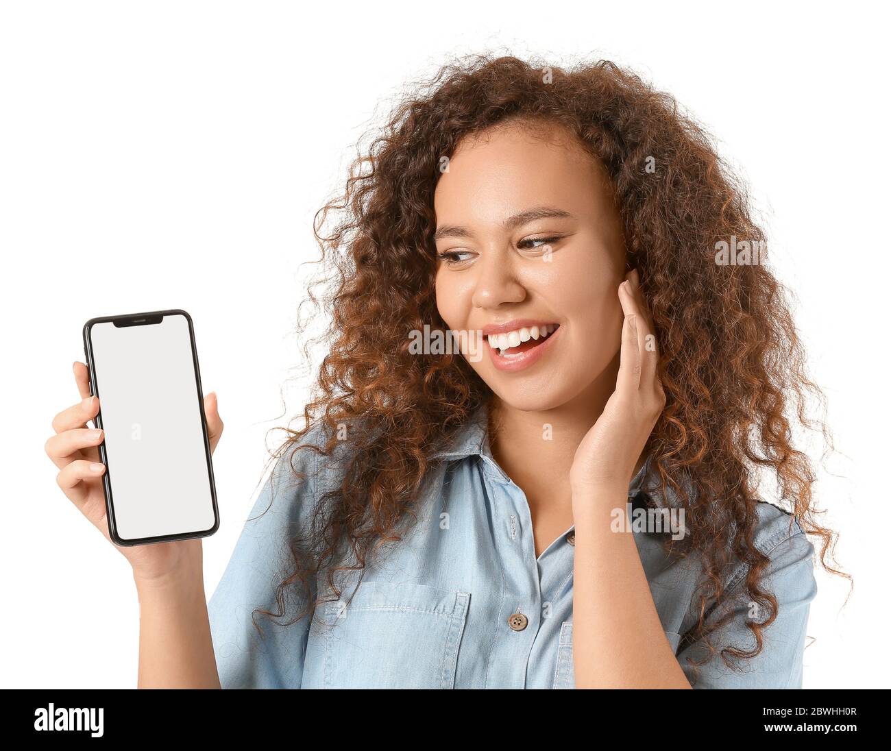 African-American woman with mobile phone on white background Stock ...