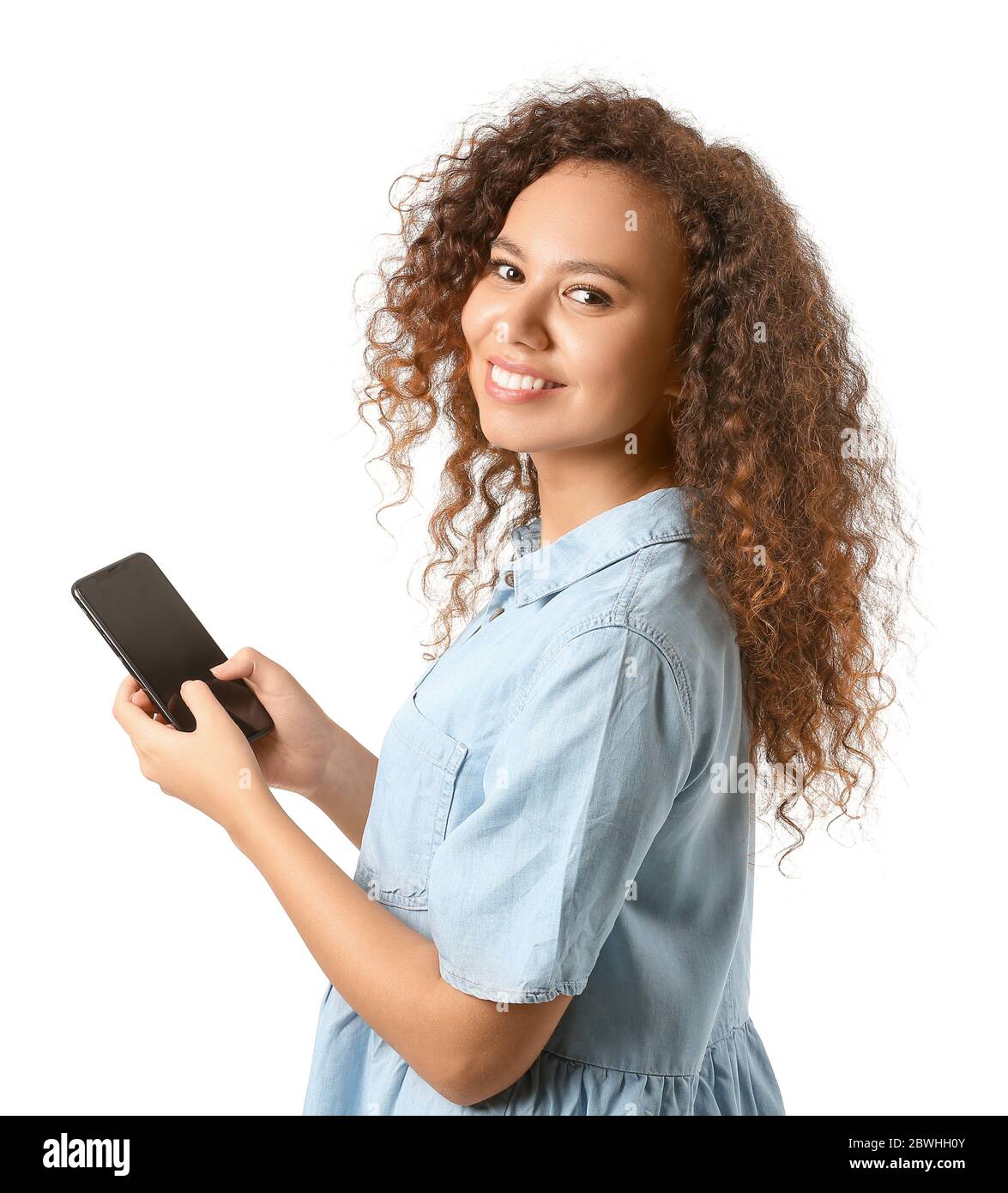 African-American woman with mobile phone on white background Stock ...
