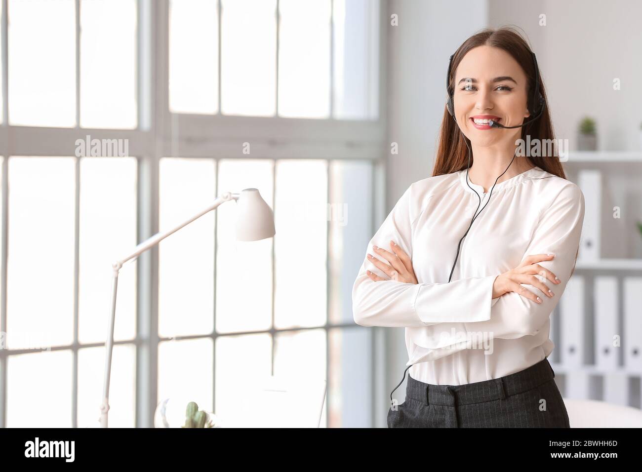 Beautiful young secretary in office Stock Photo - Alamy