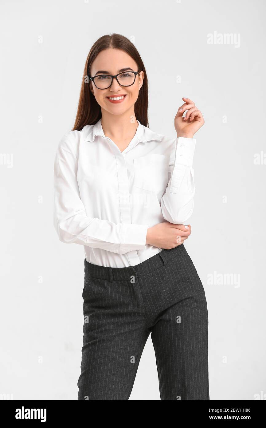 Beautiful young secretary on white background Stock Photo - Alamy