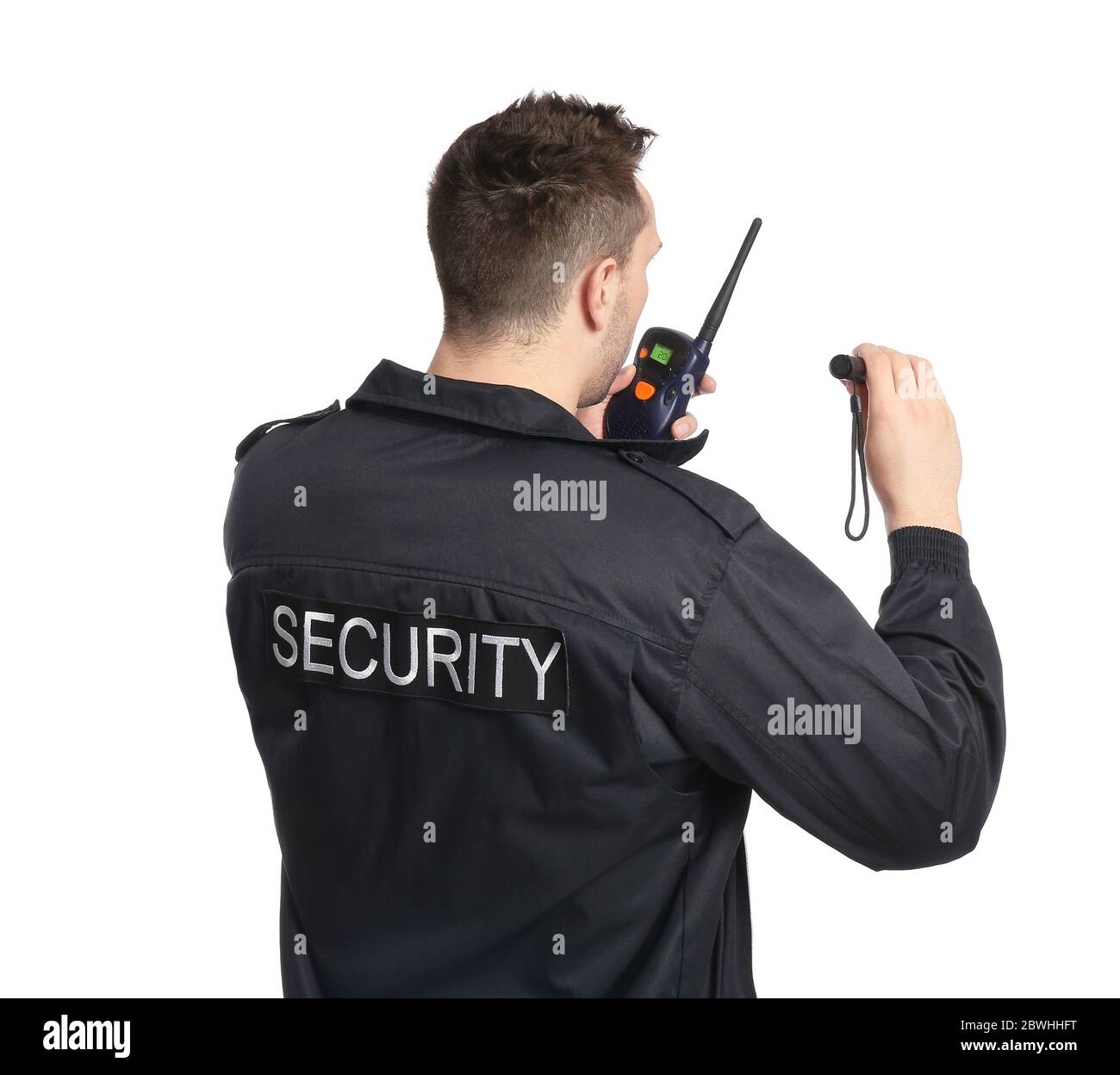 Male security guard with flashlight on white background Stock Photo - Alamy