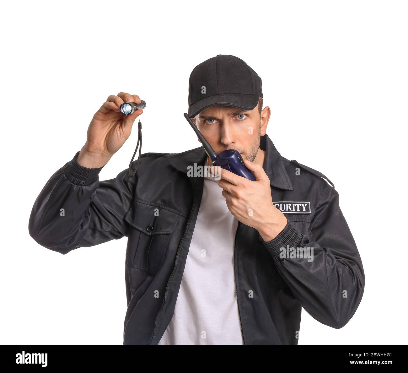Male security guard with flashlight on white background Stock Photo - Alamy