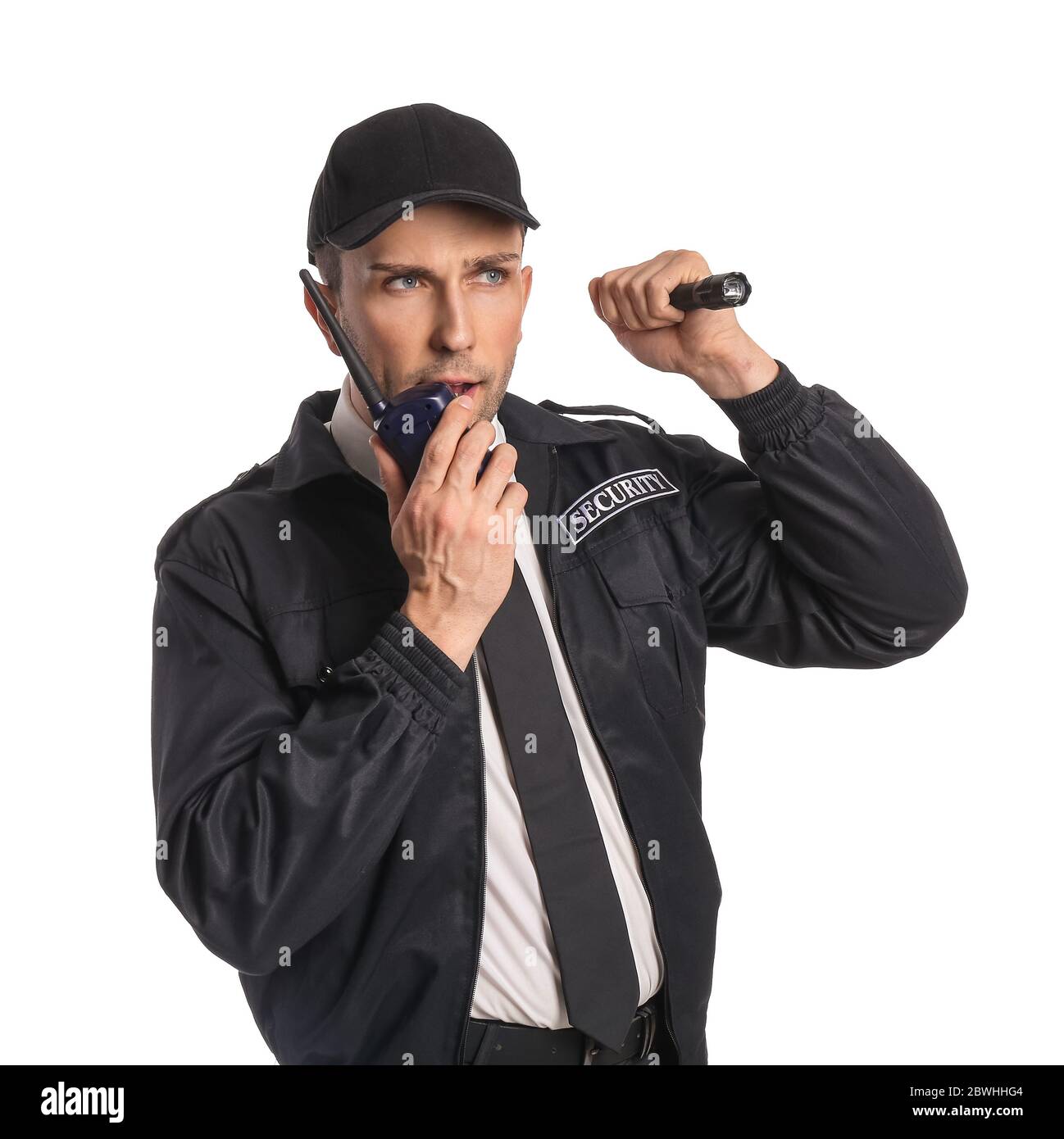 Male security guard with flashlight on white background Stock Photo - Alamy
