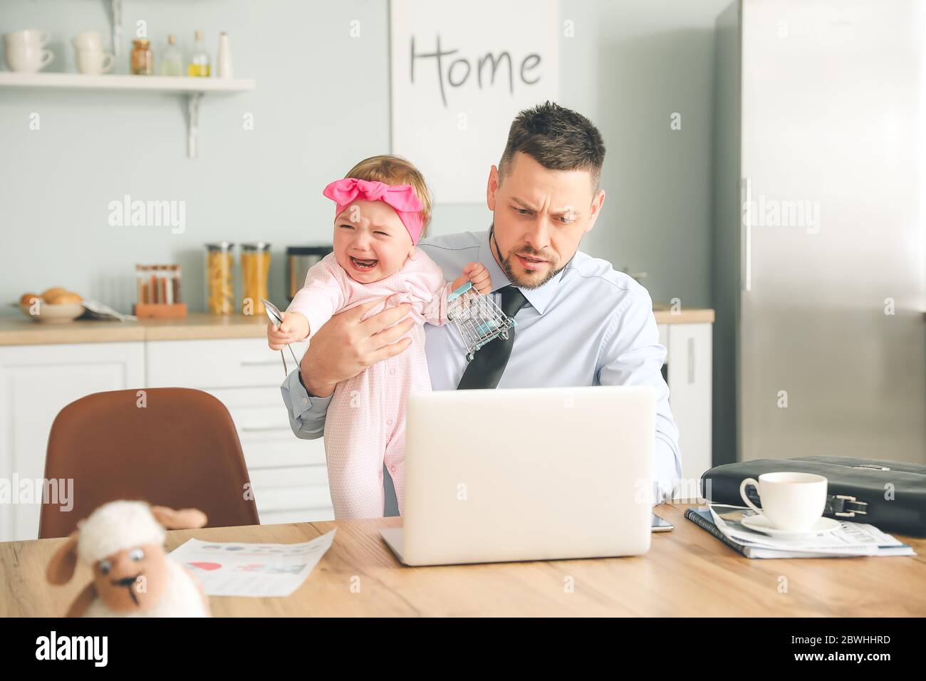Baby with laptop crying hi-res stock photography and images - Alamy