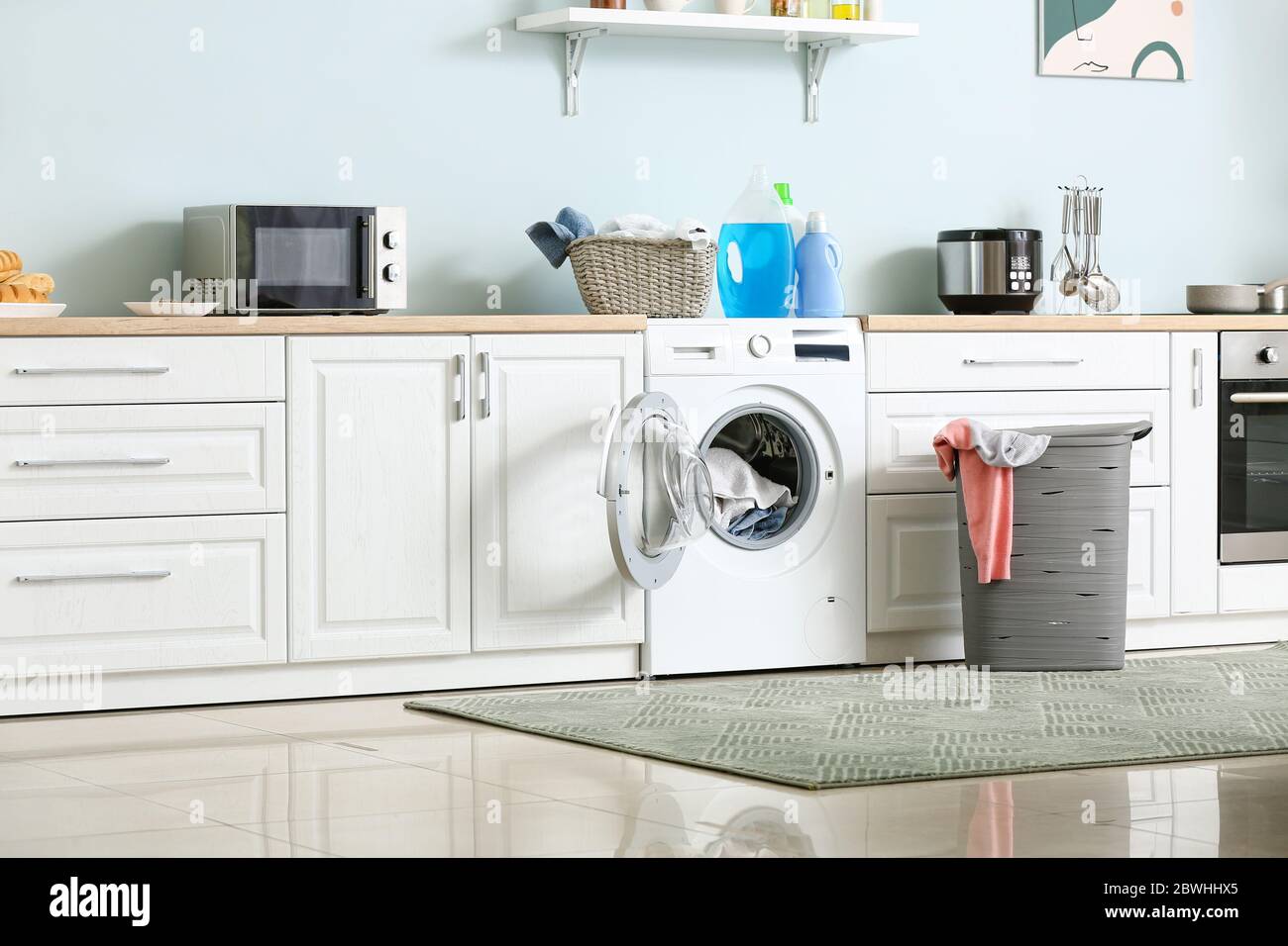 Interior of kitchen with modern washing machine Stock Photo - Alamy