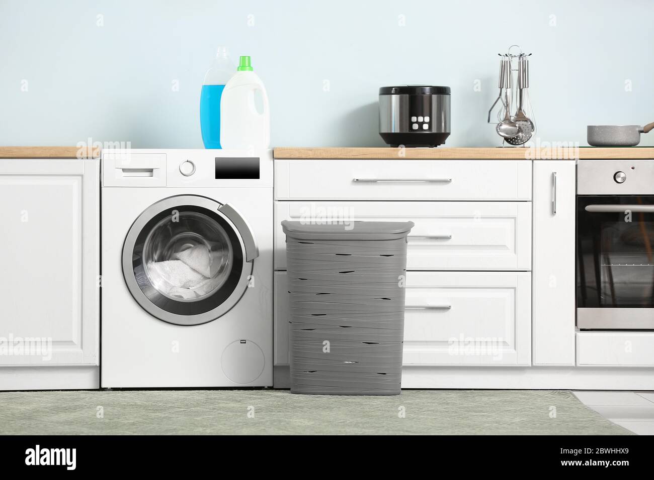 Interior of kitchen with modern washing machine Stock Photo - Alamy