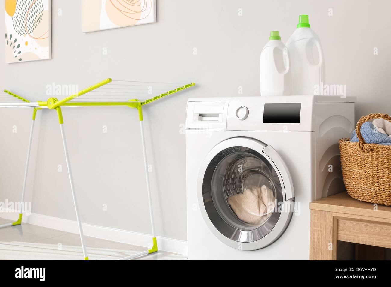 Modern washing machine in bathroom Stock Photo - Alamy