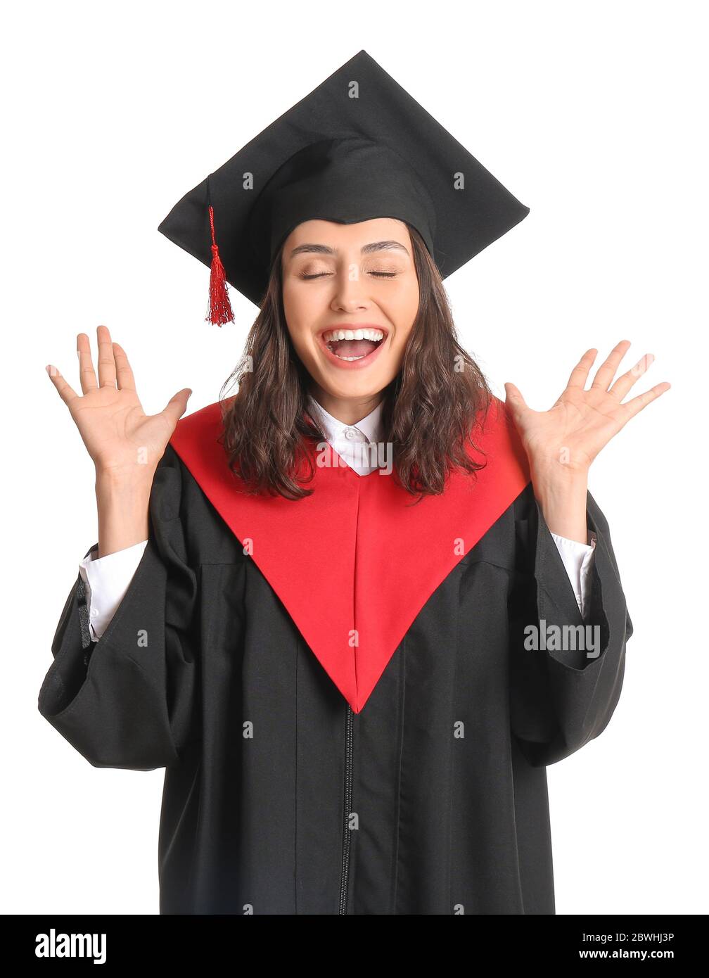 Happy female graduating student on white background Stock Photo - Alamy