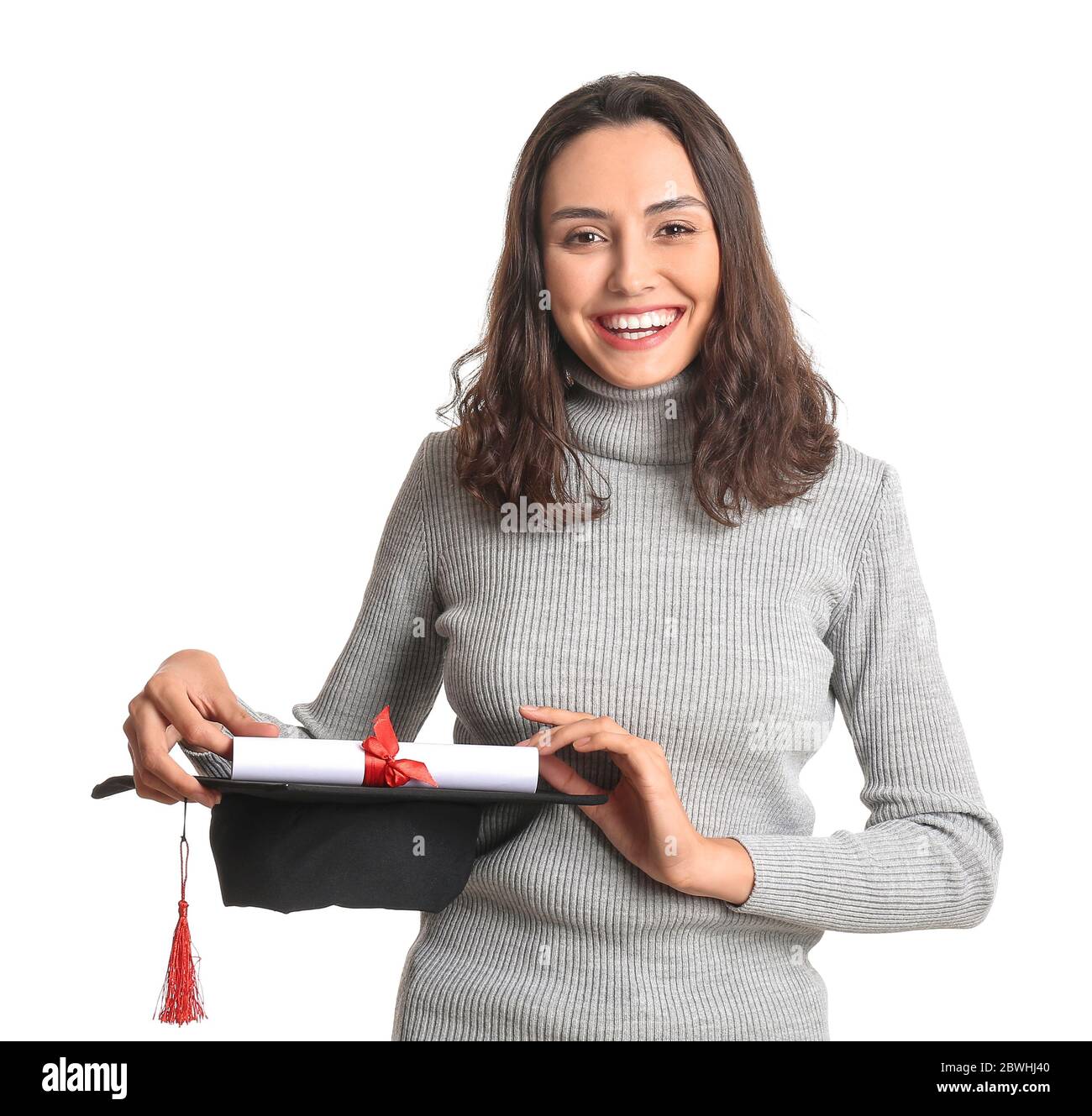Female graduating student with diploma on white background Stock Photo ...