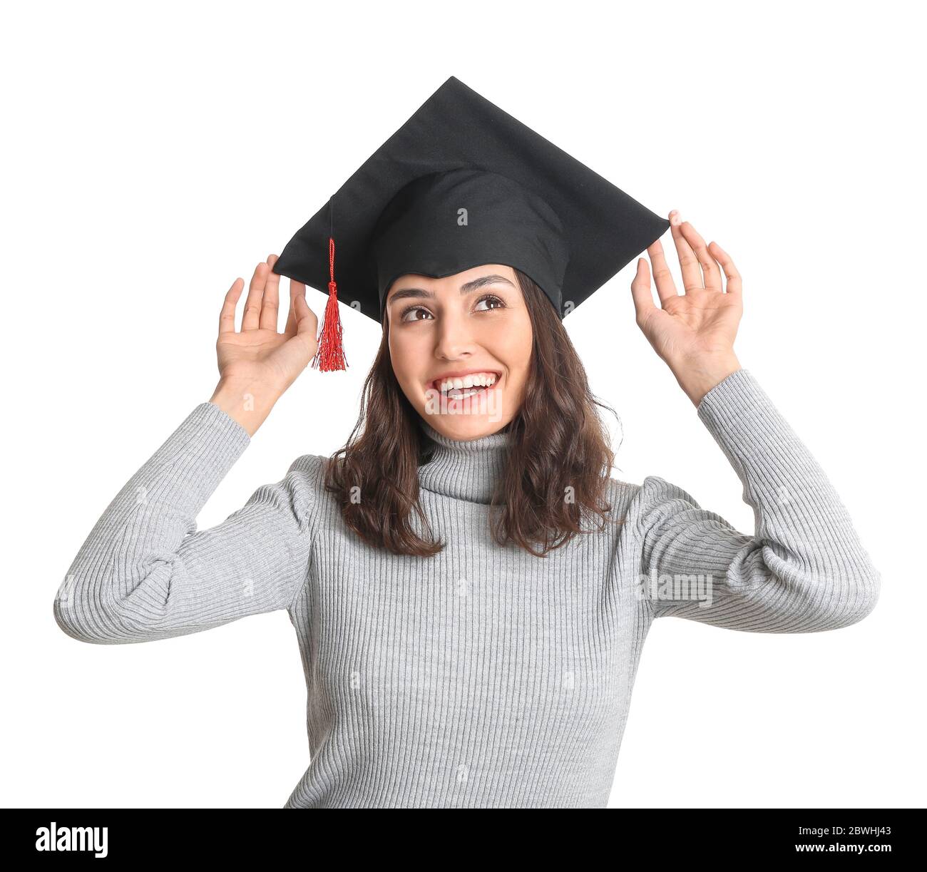 Female graduating student on white background Stock Photo - Alamy
