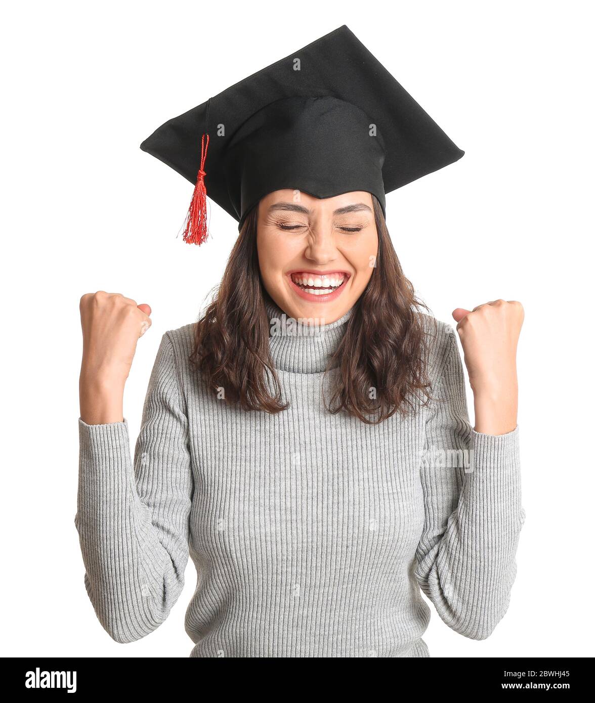 Happy female graduating student on white background Stock Photo - Alamy