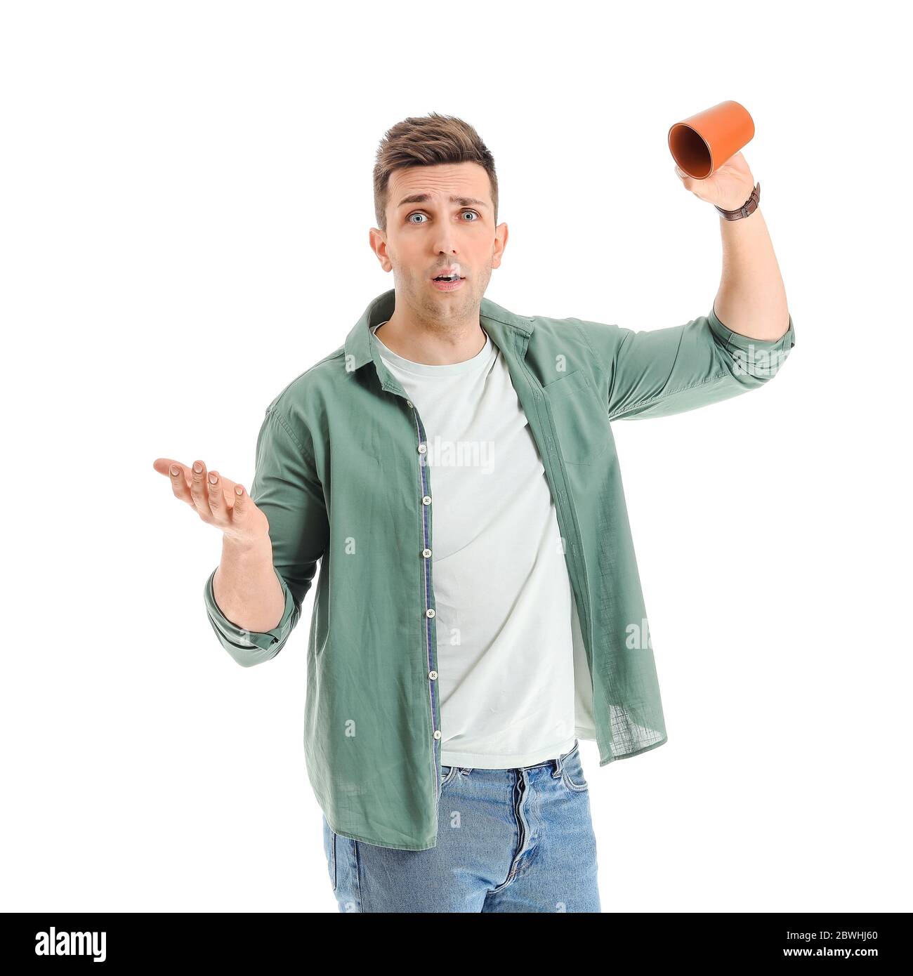 Sad man with empty cup on white background Stock Photo - Alamy