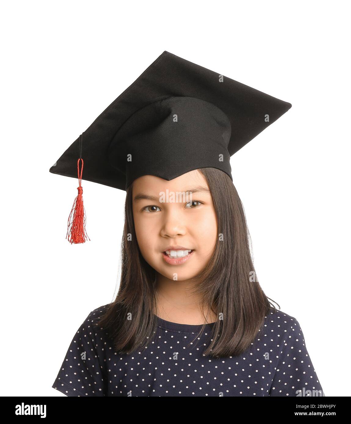 Little girl in graduation hat on white background Stock Photo - Alamy