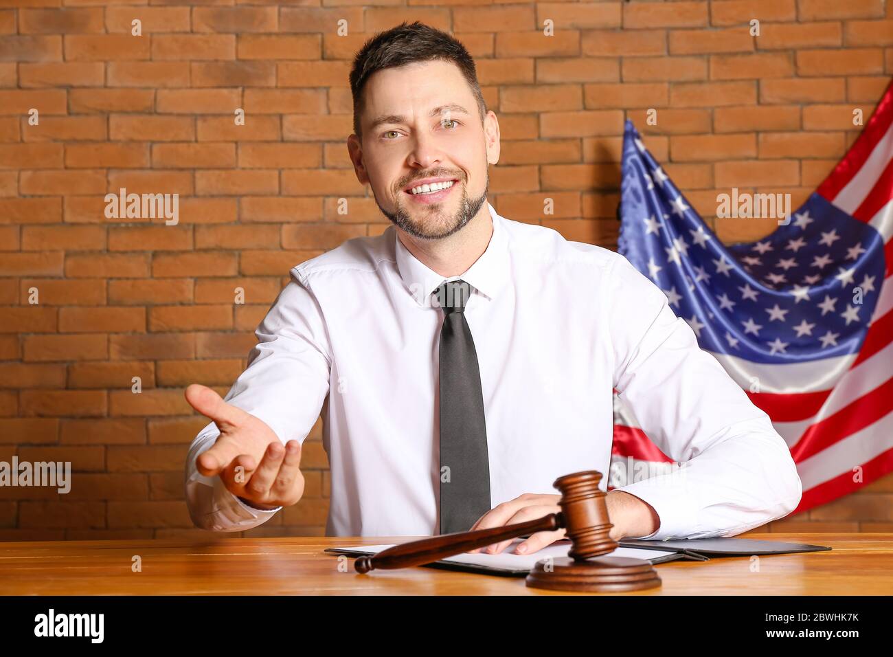 Male judge at table in courtroom Stock Photo - Alamy