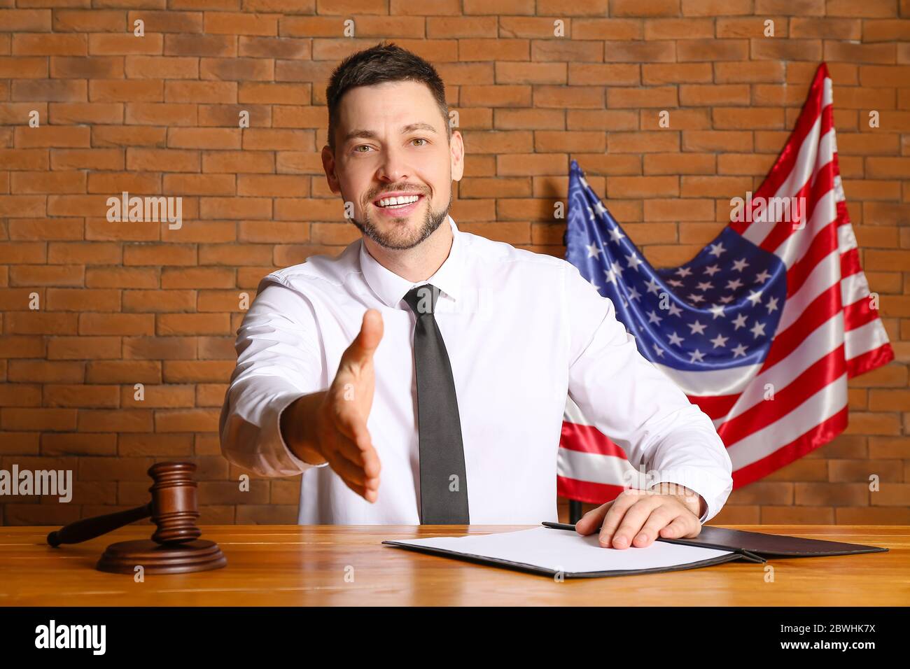 Male judge at table in courtroom Stock Photo - Alamy