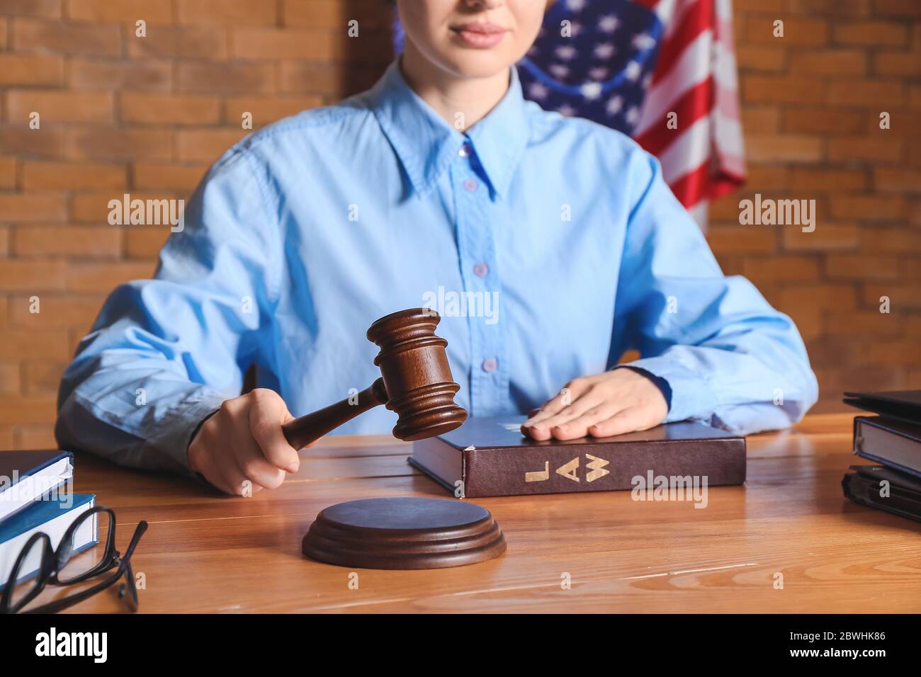 Female judge at table in courtroom Stock Photo - Alamy
