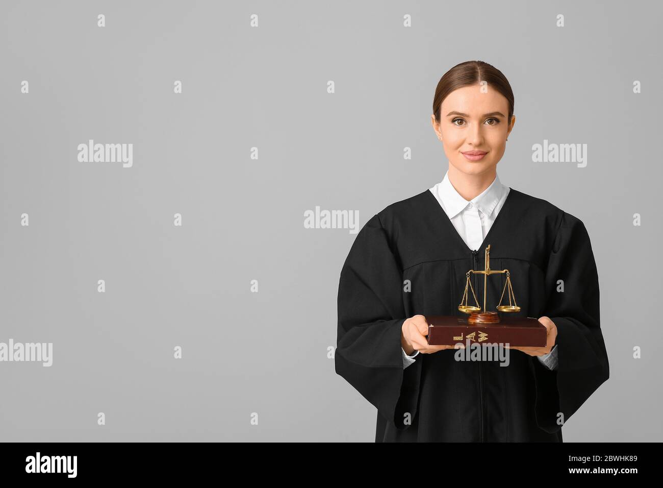 Female judge on light background Stock Photo - Alamy