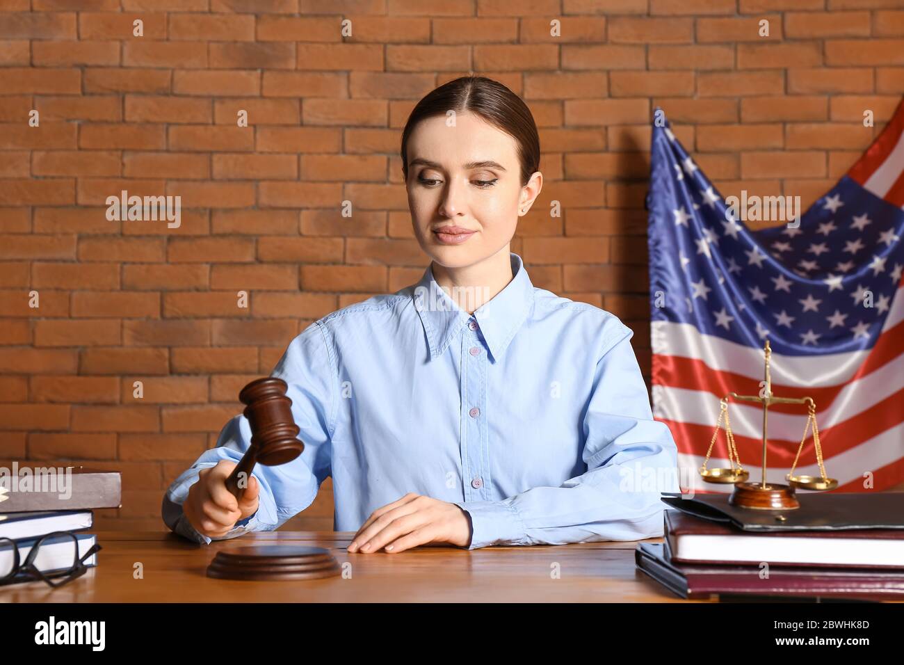 Female judge at table in courtroom Stock Photo - Alamy