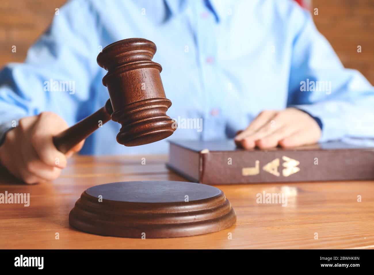 Female judge with gavel at table in courtroom, closeup Stock Photo - Alamy