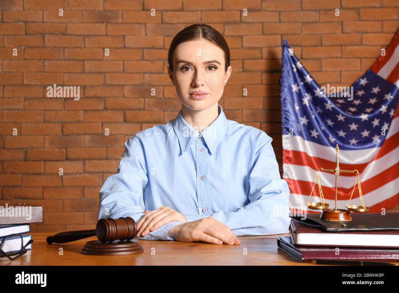 Female judge at table in courtroom Stock Photo - Alamy
