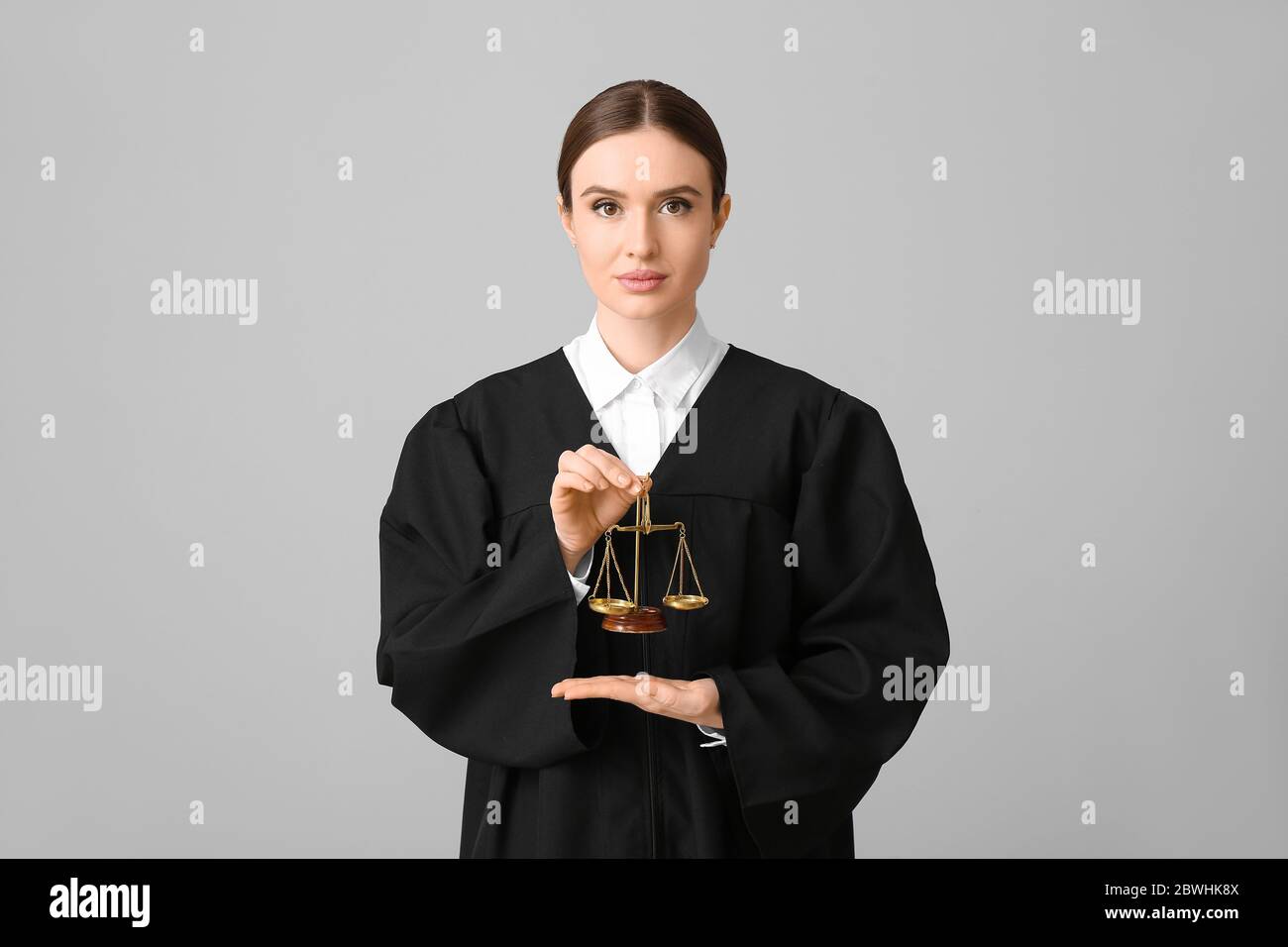 Female judge on light background Stock Photo - Alamy