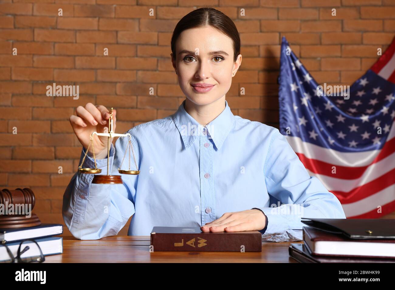 Female judge at table in courtroom Stock Photo - Alamy