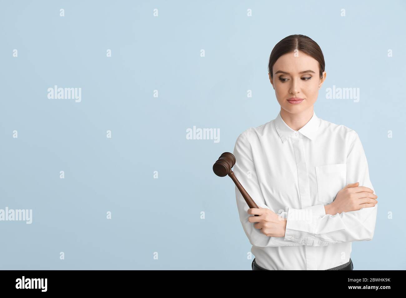 Female judge on light background Stock Photo - Alamy