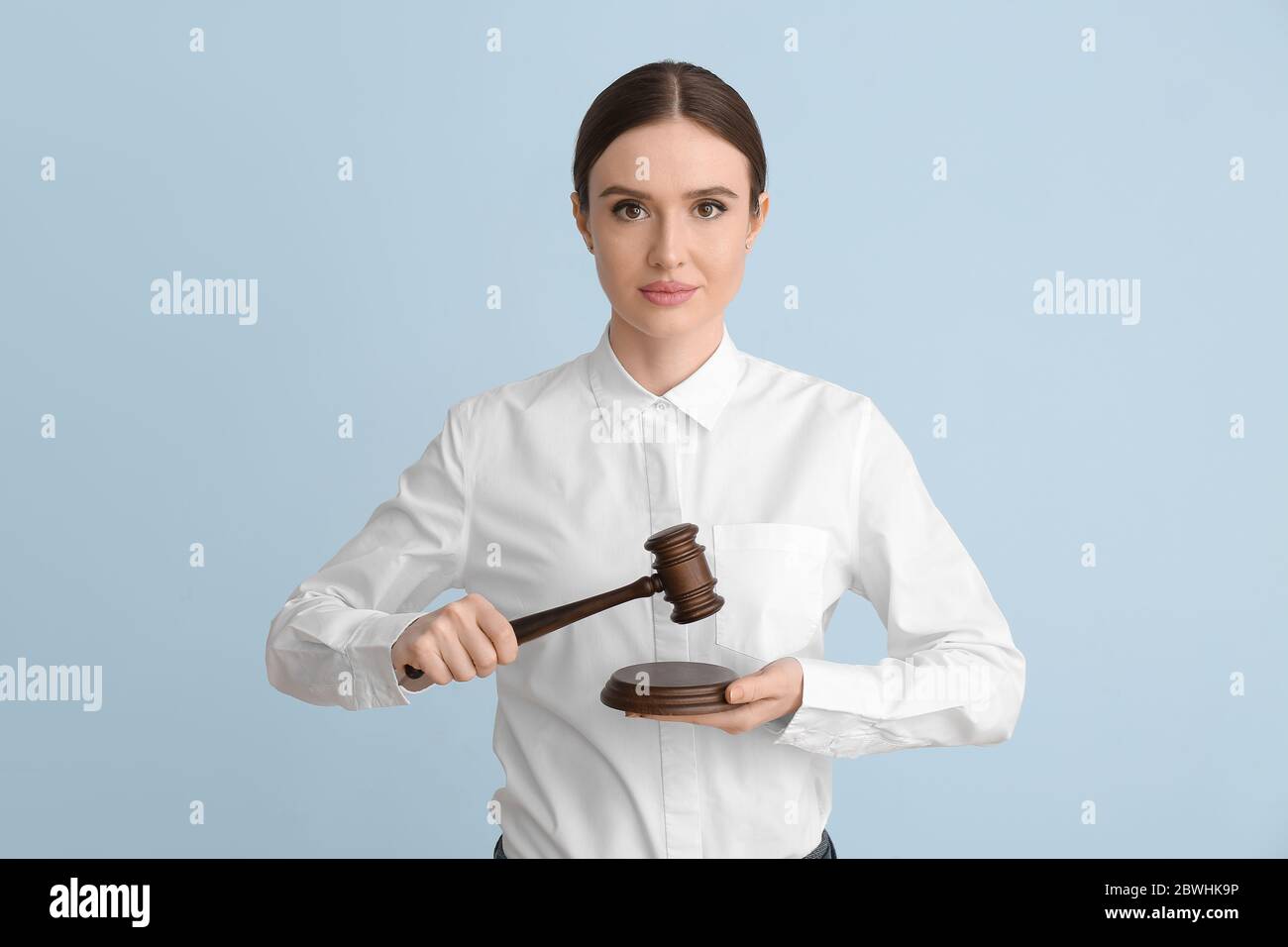 Female judge on light background Stock Photo - Alamy