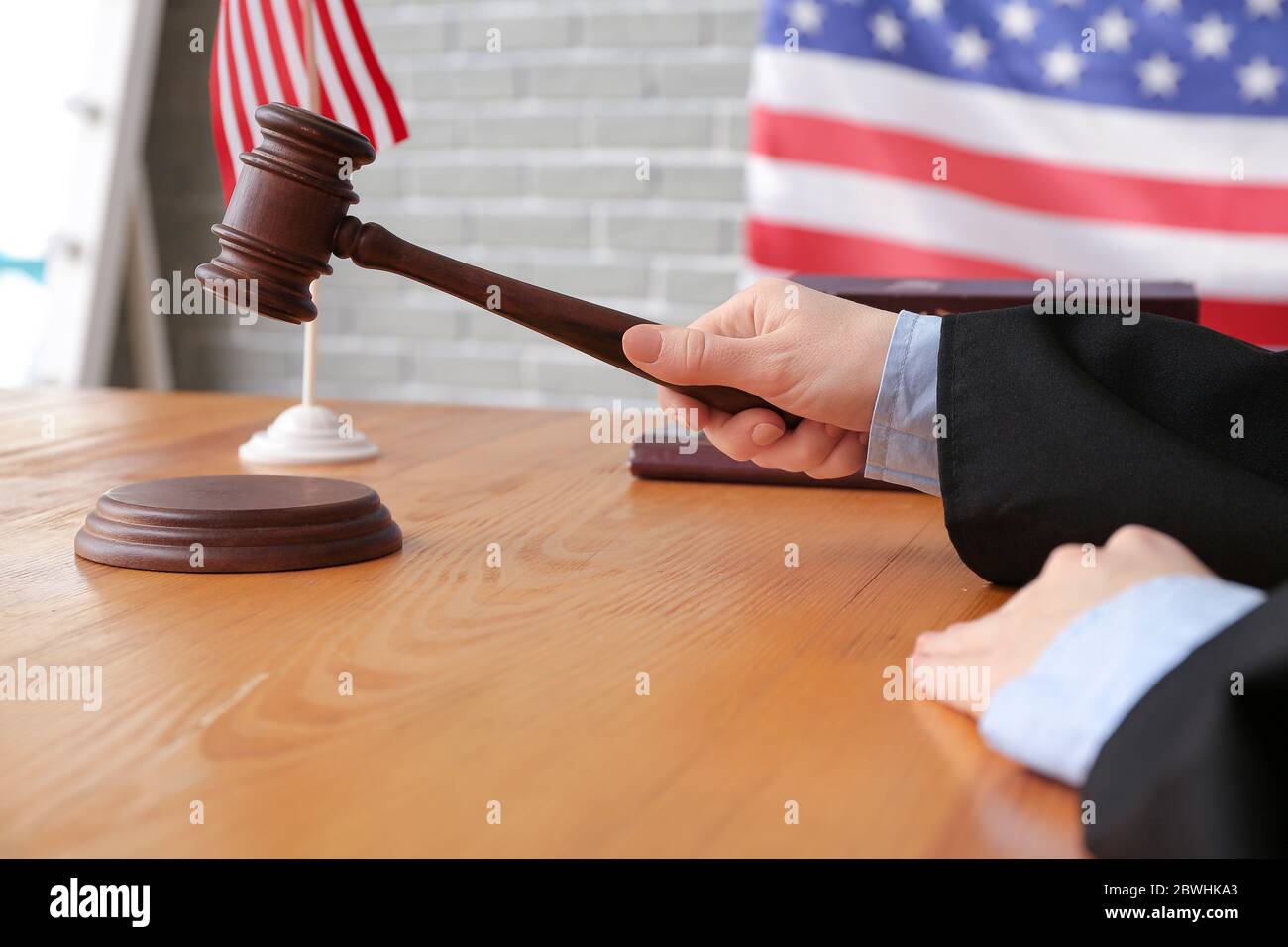 Female judge with gavel at table in courtroom, closeup Stock Photo - Alamy