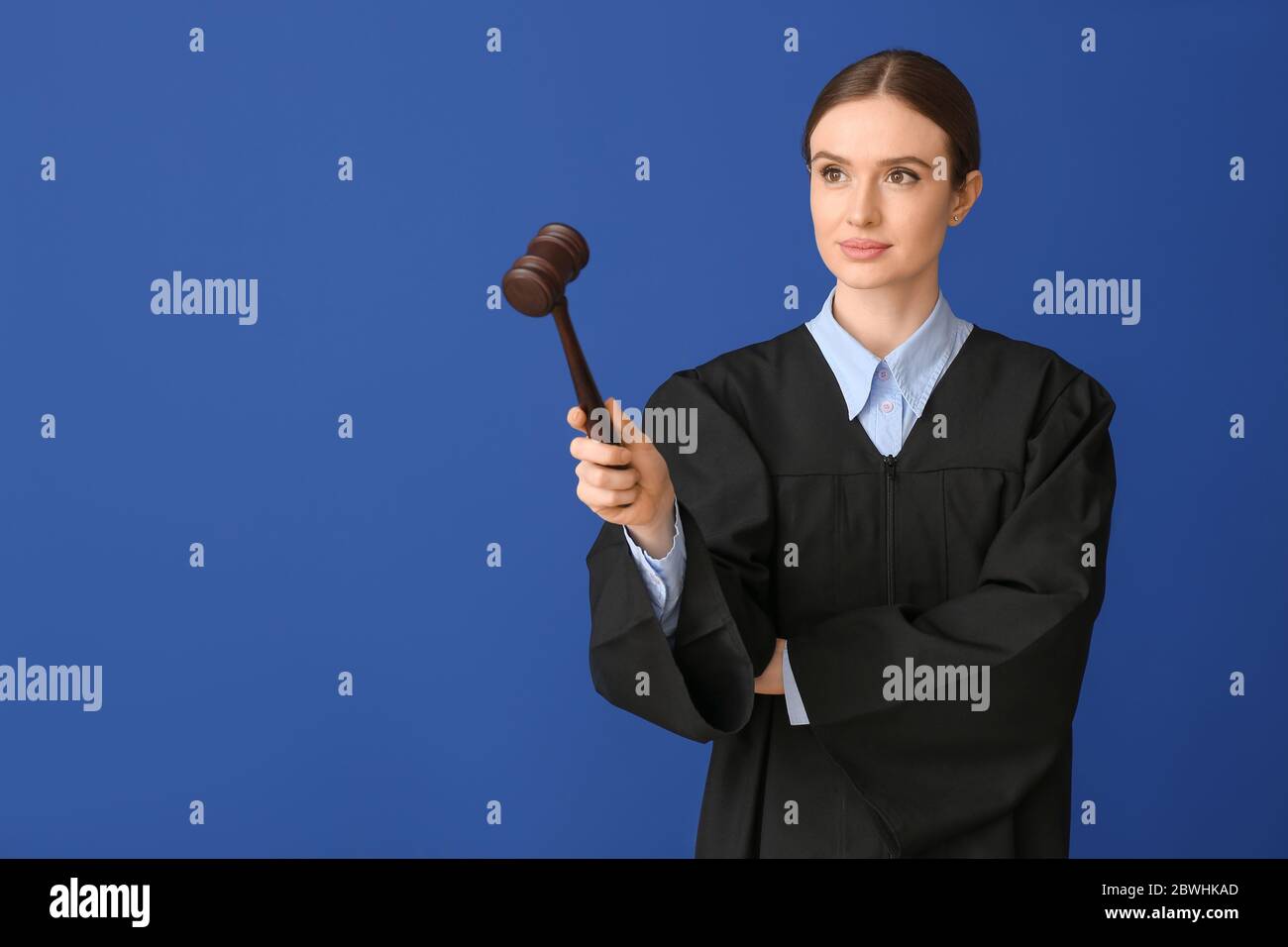Female judge on color background Stock Photo - Alamy
