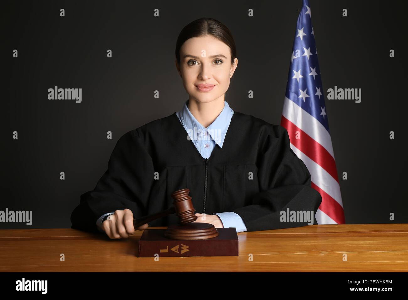 Female judge at table in courtroom Stock Photo - Alamy