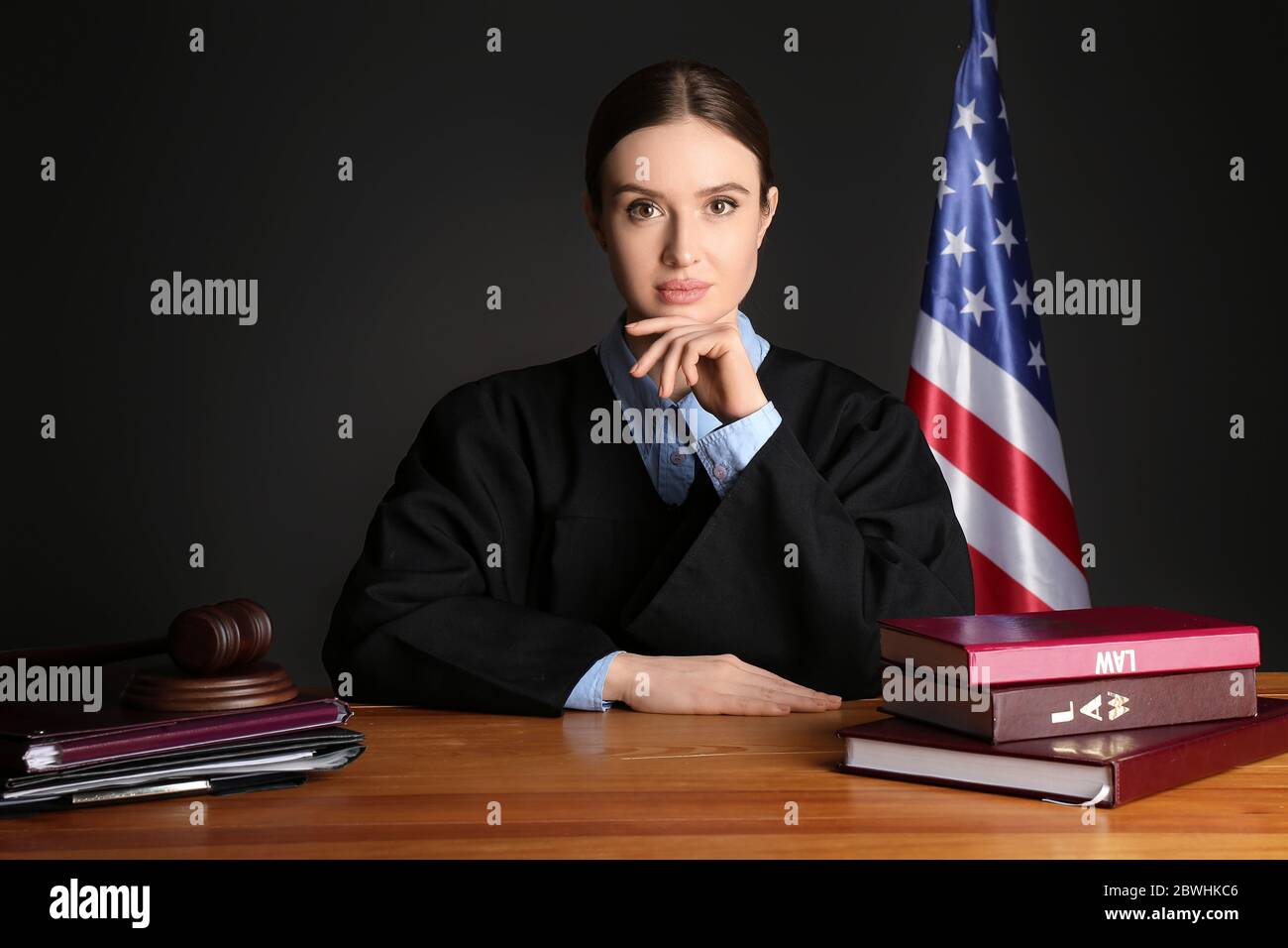Female judge at table in courtroom Stock Photo - Alamy