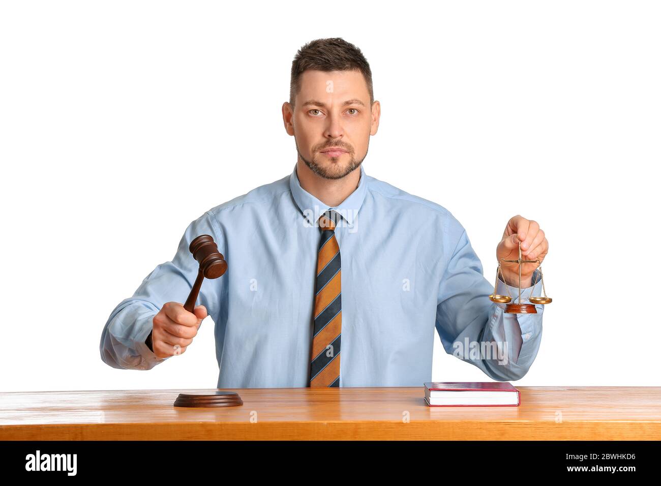 Male judge at table on white background Stock Photo - Alamy