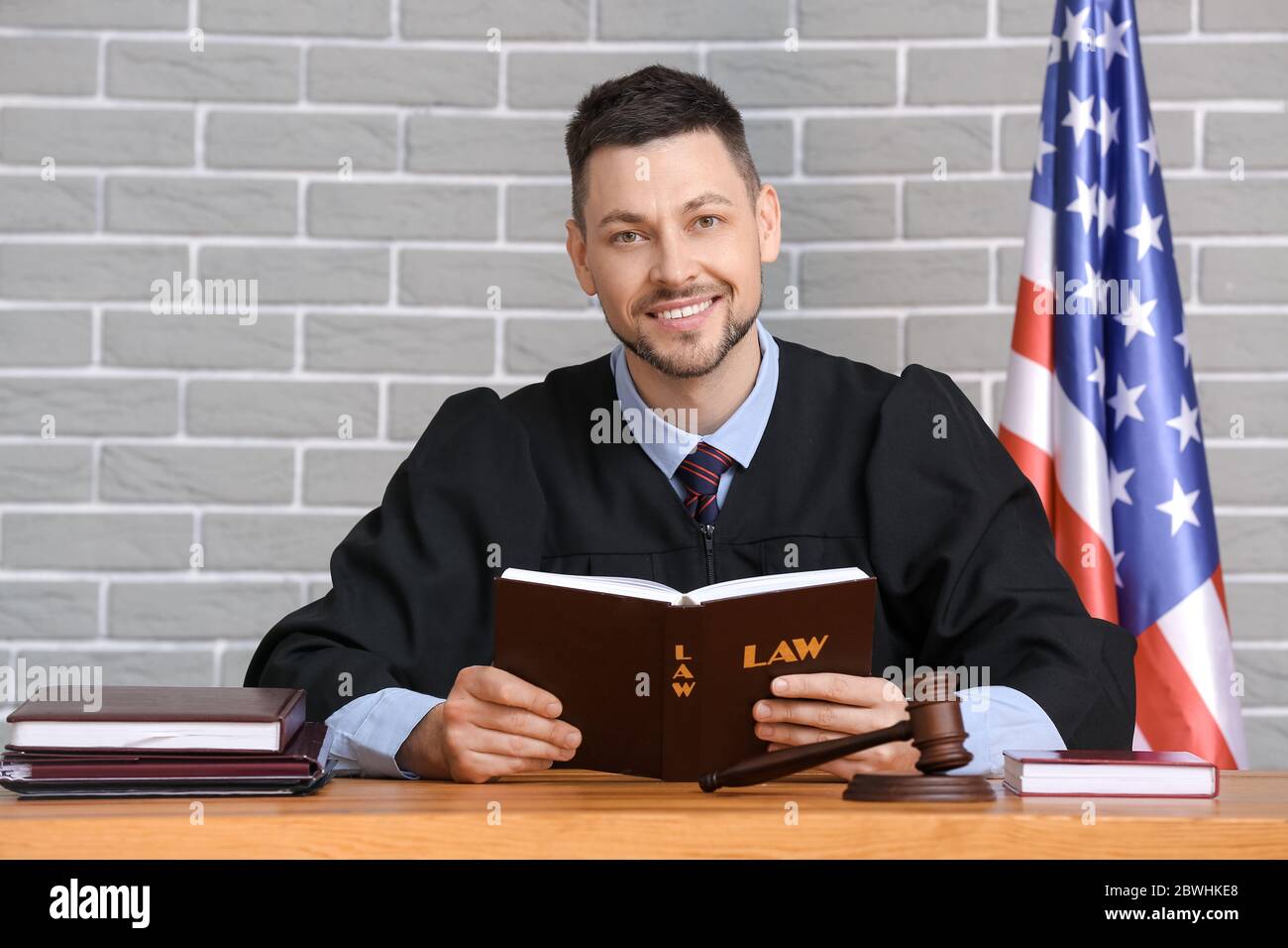 Male judge book table hi-res stock photography and images - Alamy