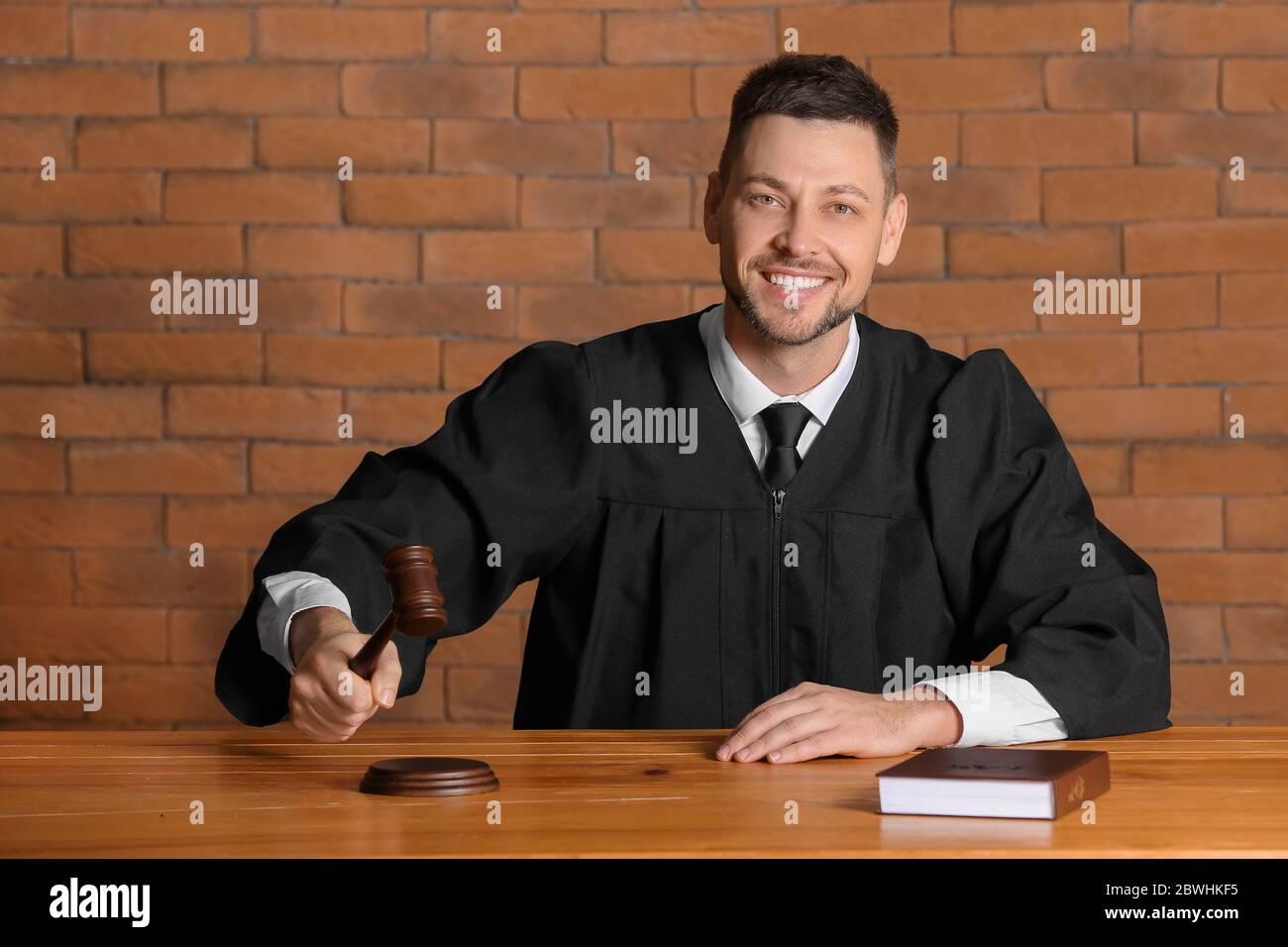 Male judge at table in courtroom Stock Photo - Alamy