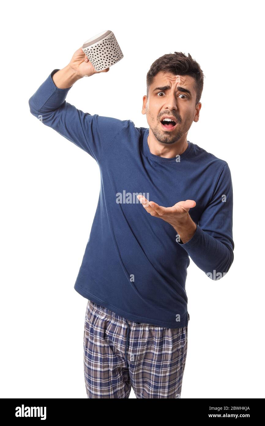 Sad young man with empty cup on white background Stock Photo - Alamy