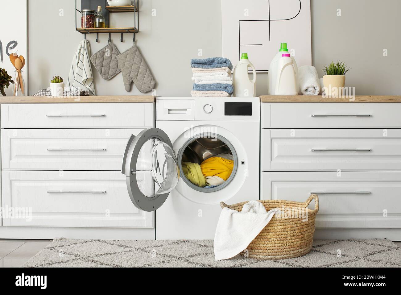 Interior of modern kitchen with washing machine Stock Photo - Alamy