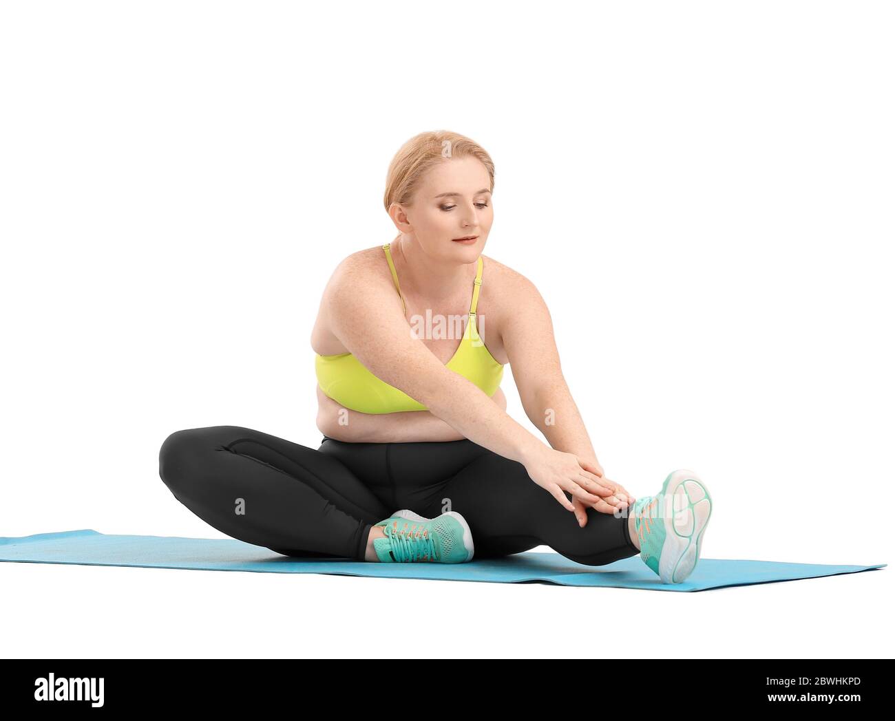 Woman with excess weight training on white background Stock Photo - Alamy