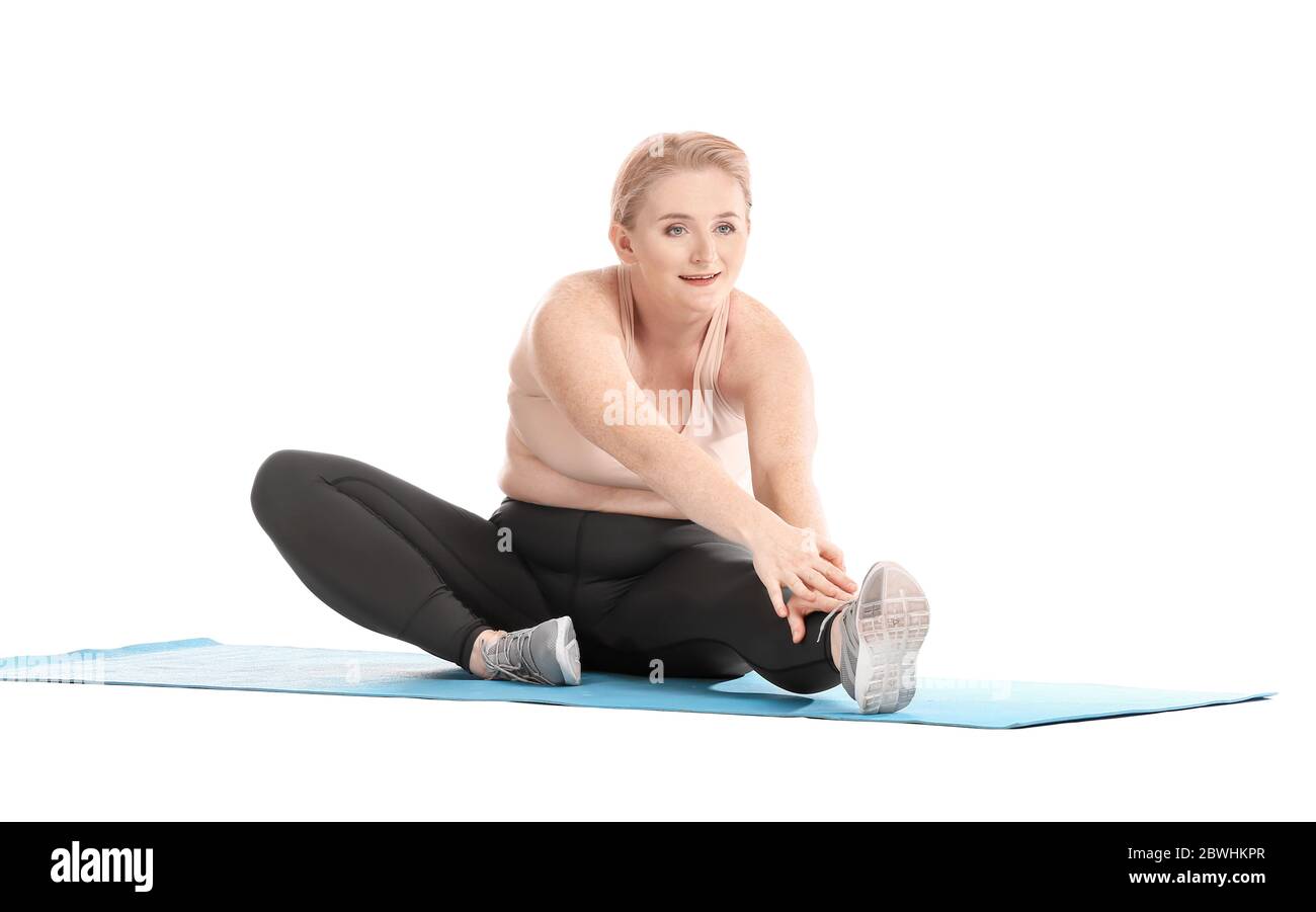 Woman with excess weight training on white background Stock Photo - Alamy