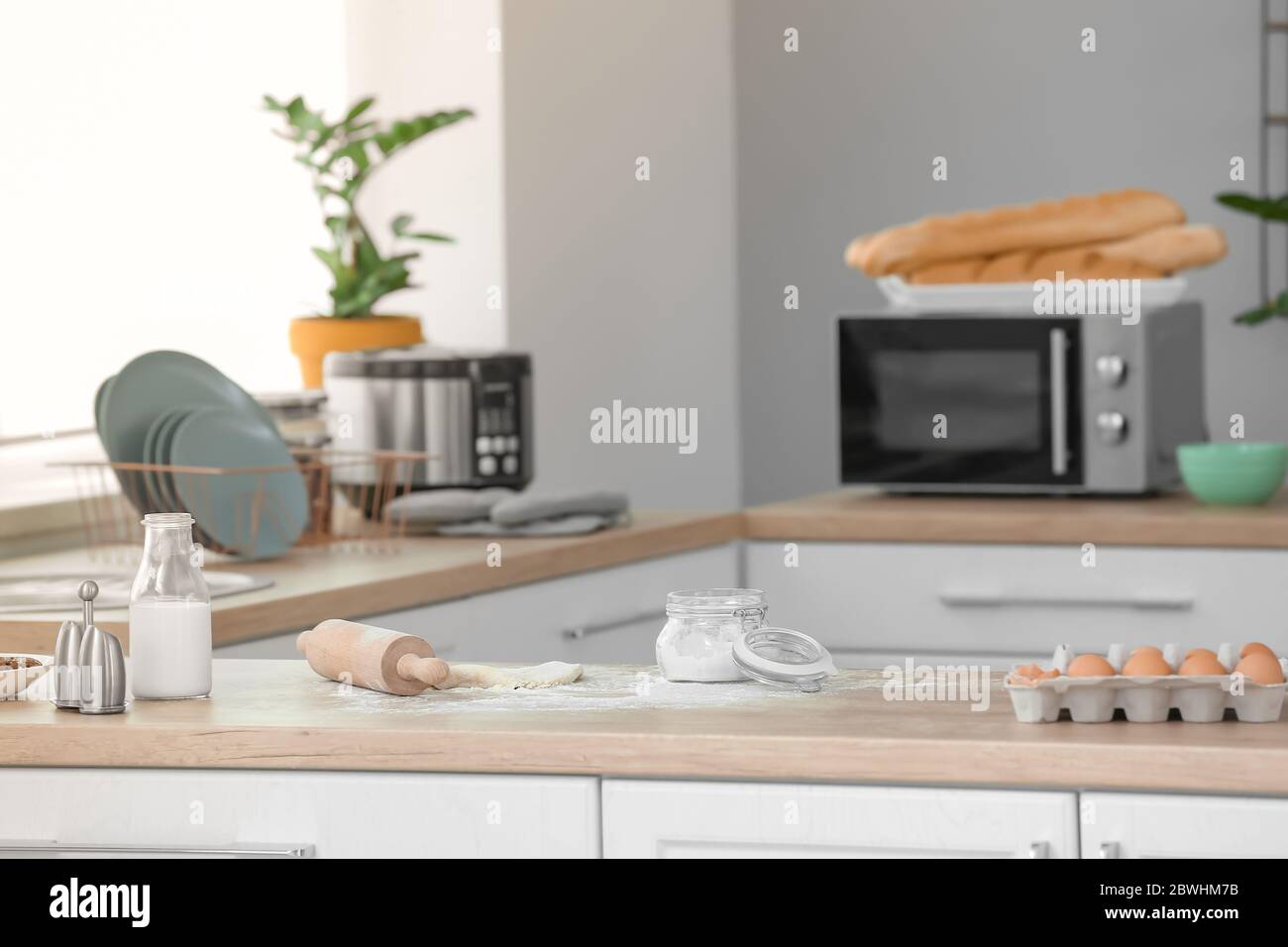 Kneading dough in modern kitchen hi-res stock photography and images ...