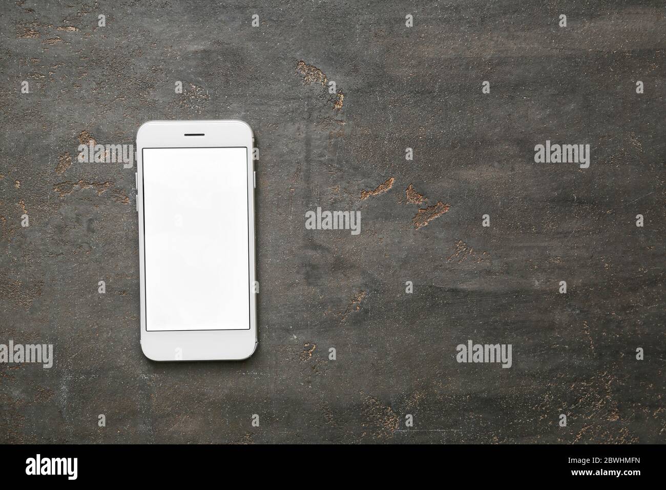 Modern mobile phone on dark background Stock Photo - Alamy